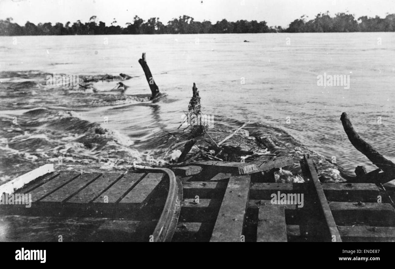 This image shows the flood-damaged railway bridge over the Burdekin ...