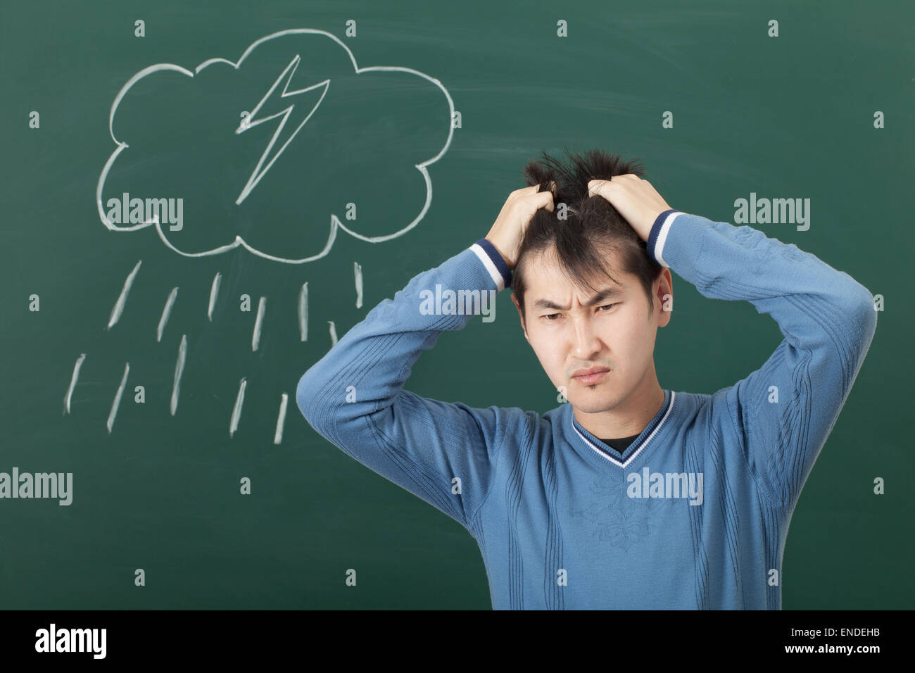 A guy with a bad mood, drawn on a blackboard cloud and rain Stock Photo ...