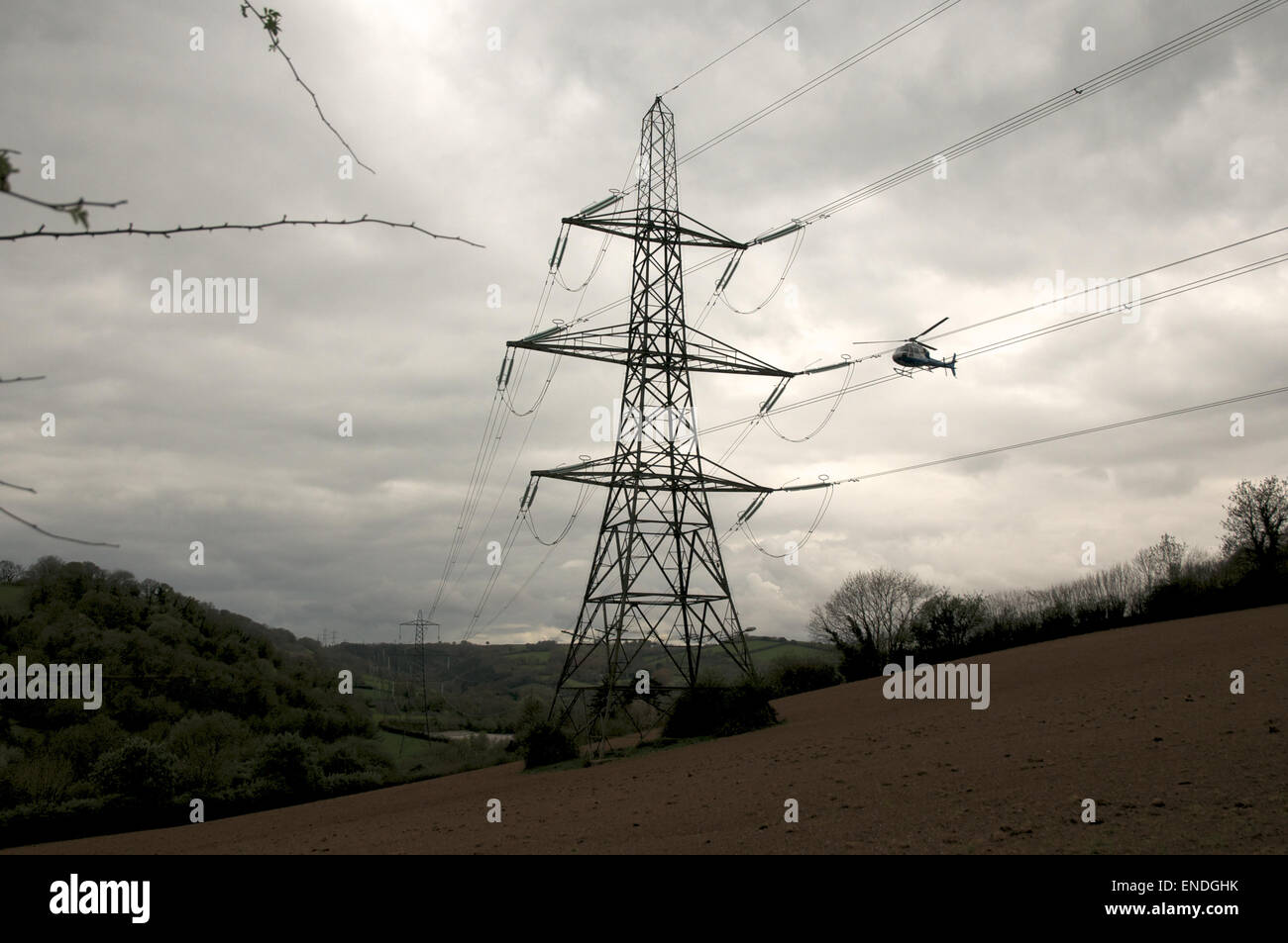Helicopter inspecting power lines Stock Photo - Alamy