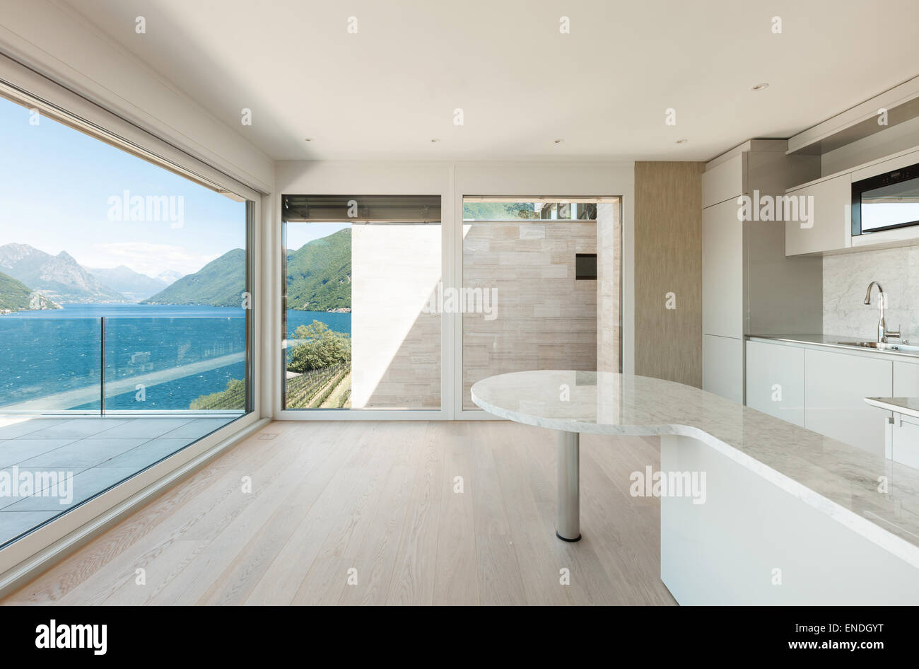 beautiful modern house, wide kitchen with window overlooking the lake ...