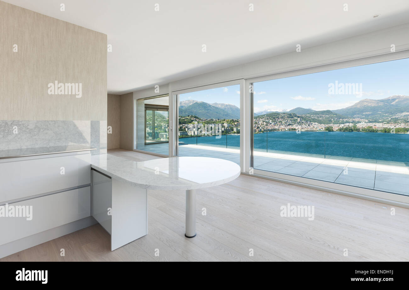 beautiful modern house, wide kitchen with window overlooking the lake ...