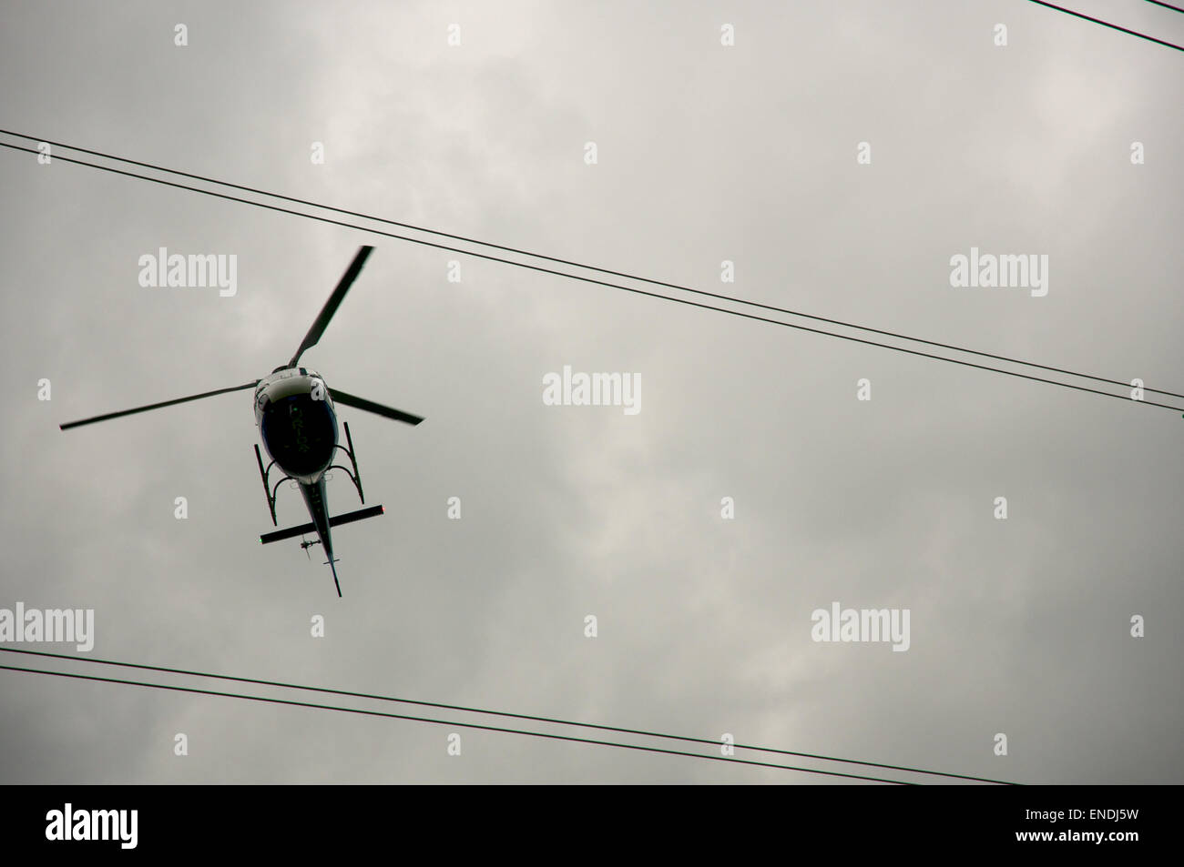 Helicopter inspecting power lines Stock Photo - Alamy