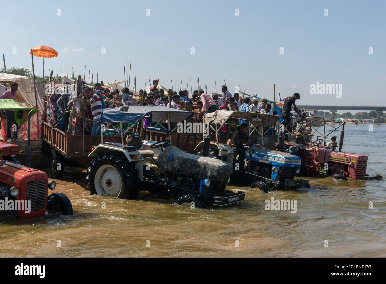 People Crossing The River On A Tractor, Vautha Mela Stock Photo - Alamy
