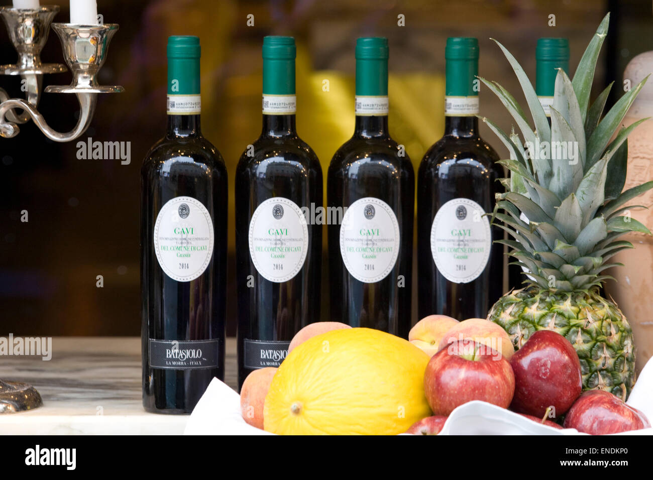 Fruit and bottles of Gavi Del comune de Gavi Granee 2014 wine Stock ...