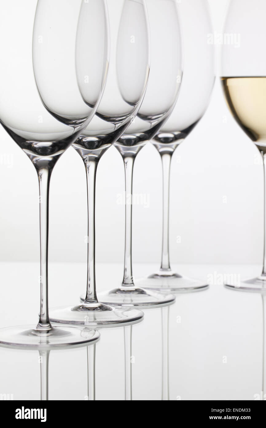 Five glasses of wine and on the white background Stock Photo - Alamy