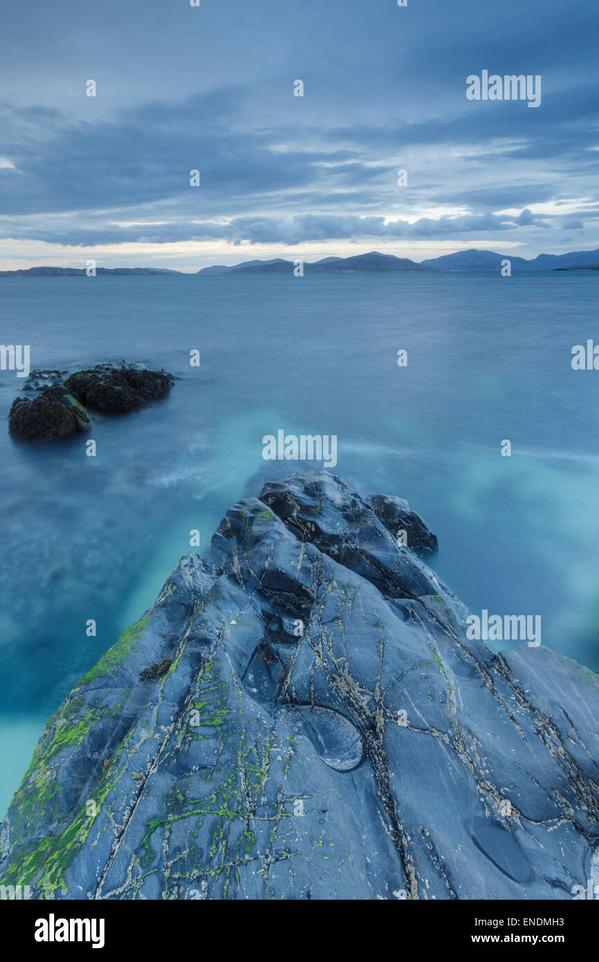 A large rock spreading out into the sea at Borve in Harris during the ...