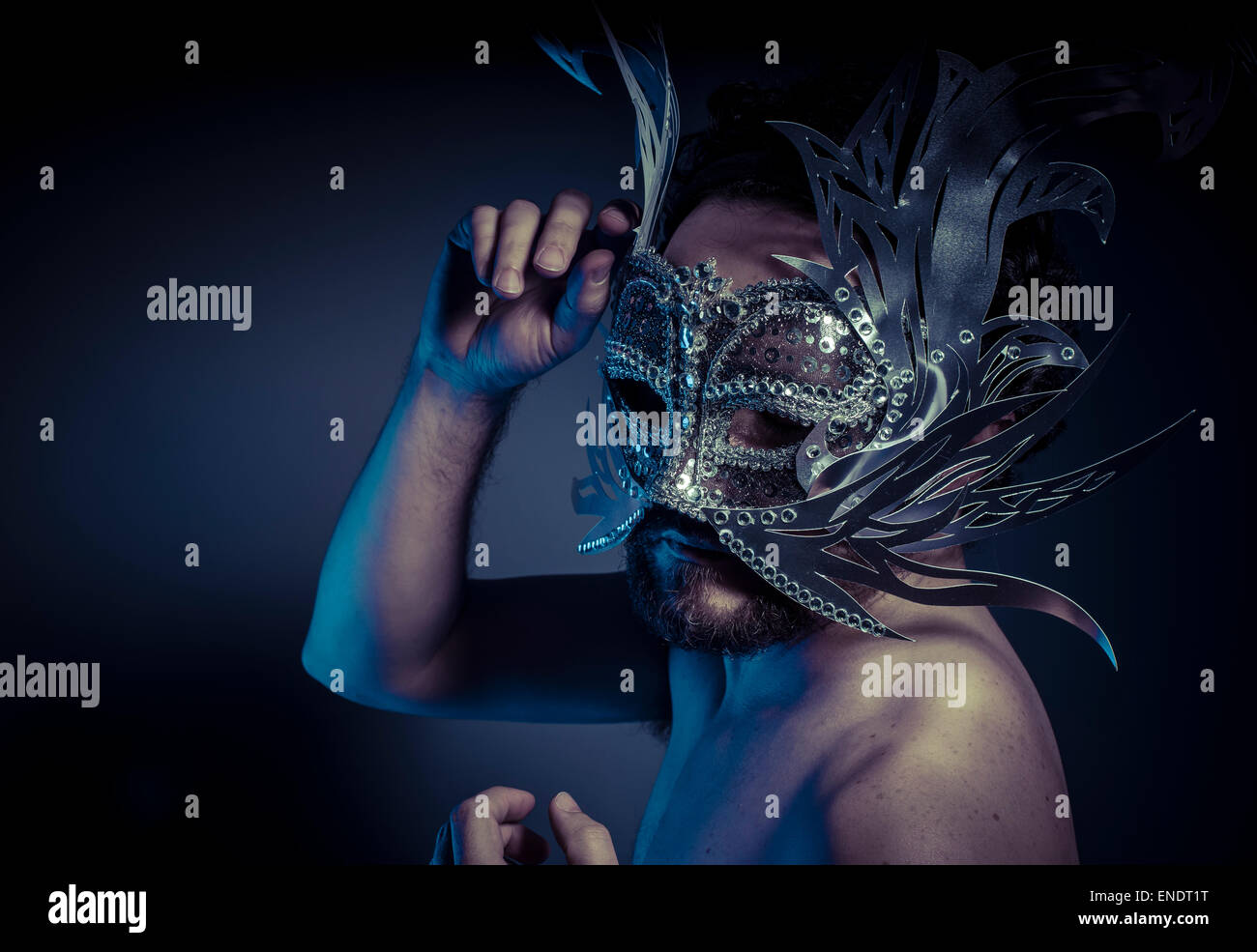 Costume, bearded man with silver mask Venetian style. Mystery and ...