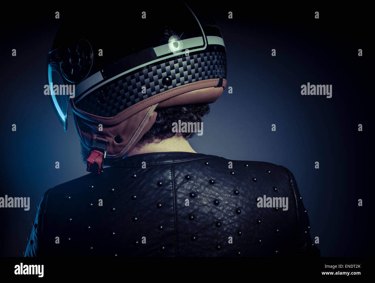 Back, biker with motorcycle helmet and black leather jacket, metal ...