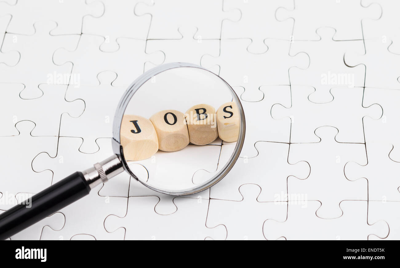 Job hunting concept with magnifying glass Stock Photo - Alamy