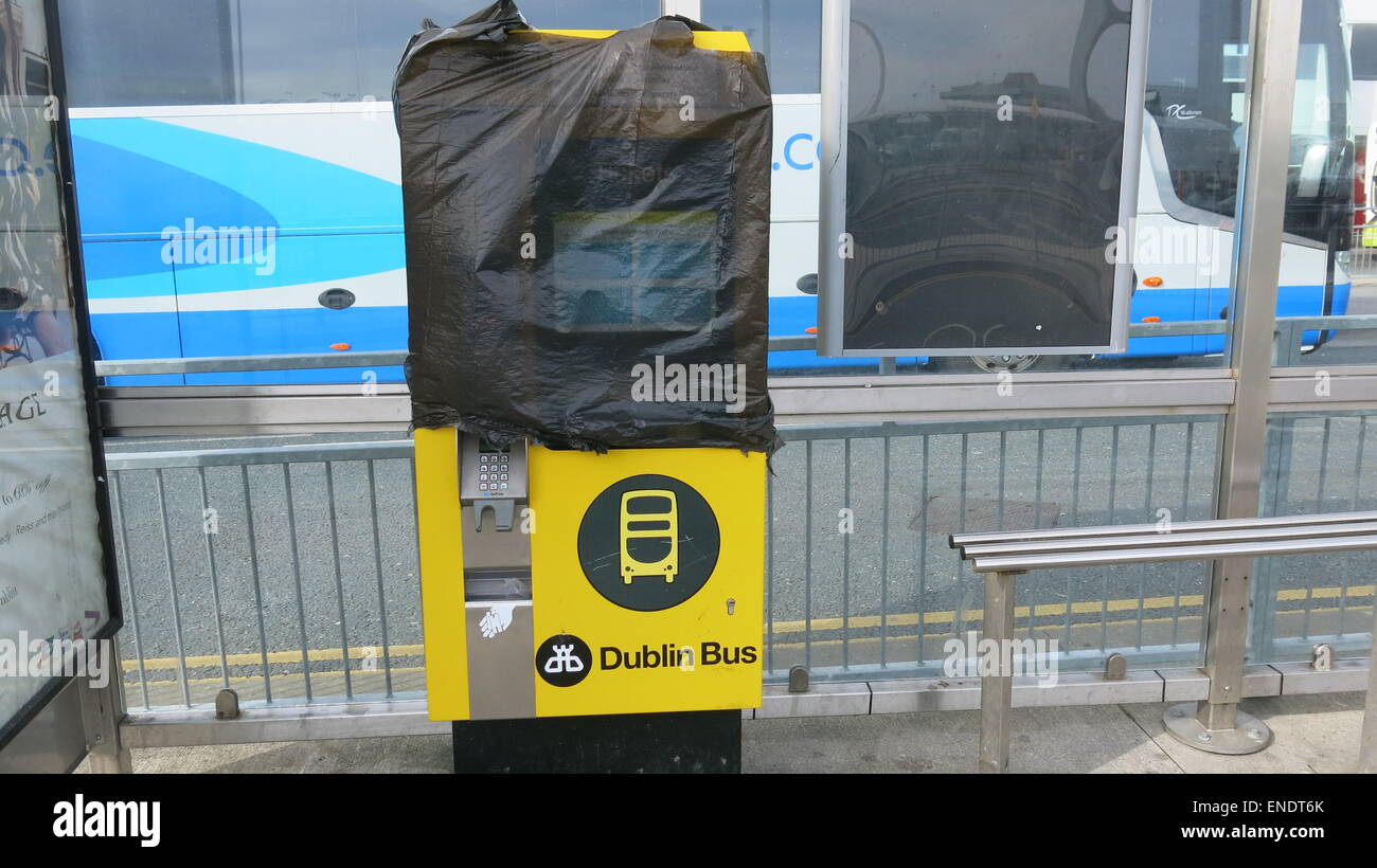 A plastic cover over a ticket machine at an empty bus stop at Dublin ...