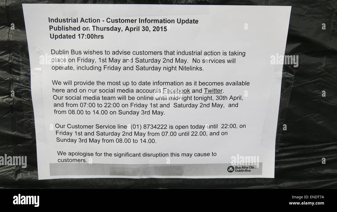 A sign notifying of strike action on a ticket machine at an empty bus ...