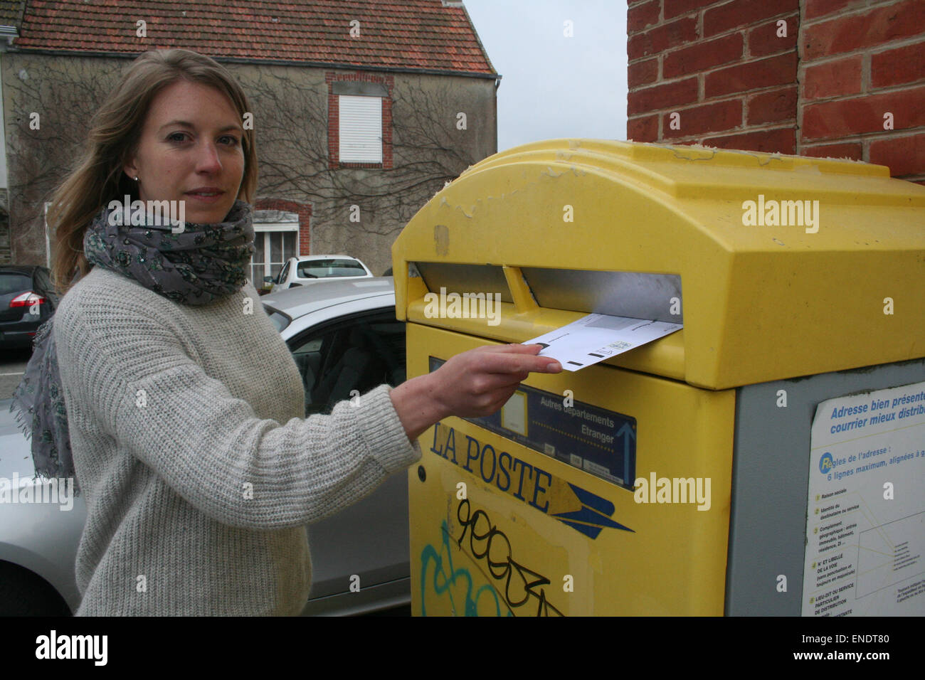 Woman posting letter in post hi-res stock photography and images - Alamy