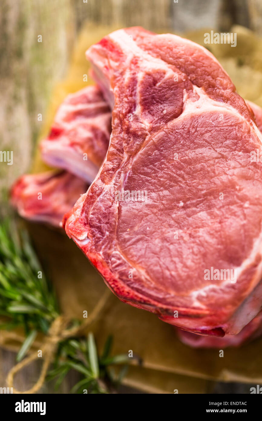Organic pork lion chops of thick cut with rosemary Stock Photo - Alamy