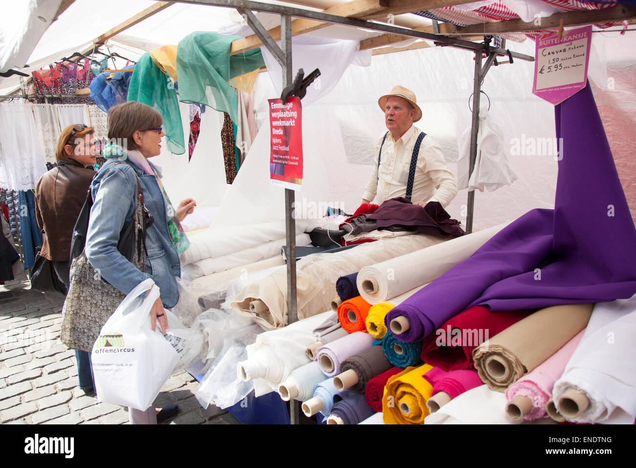 market stall with vendor of textiles in the dutch town of breda Stock ...