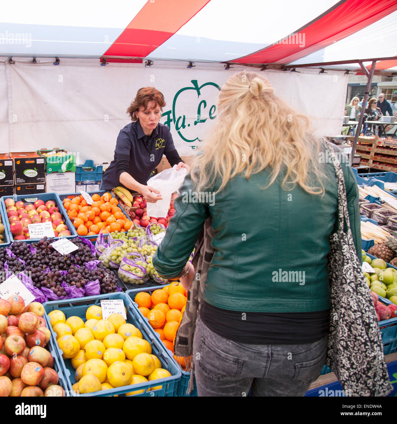 people sell fruit and vegetables on market in the dutch city of Breda ...