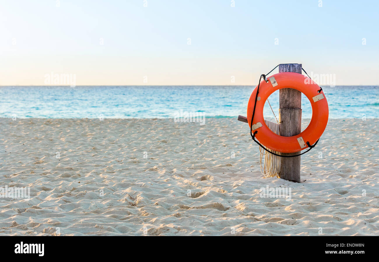Life preserver on sandy beach somewhere in Mexico Stock Photo - Alamy