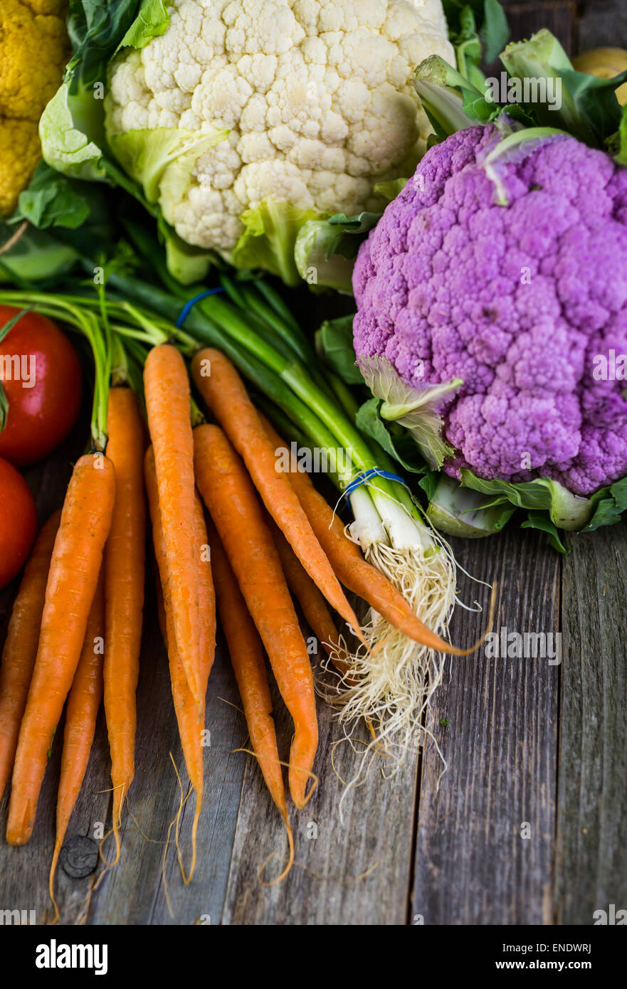 Fresh organic vegetable in season on old farm table Stock Photo - Alamy