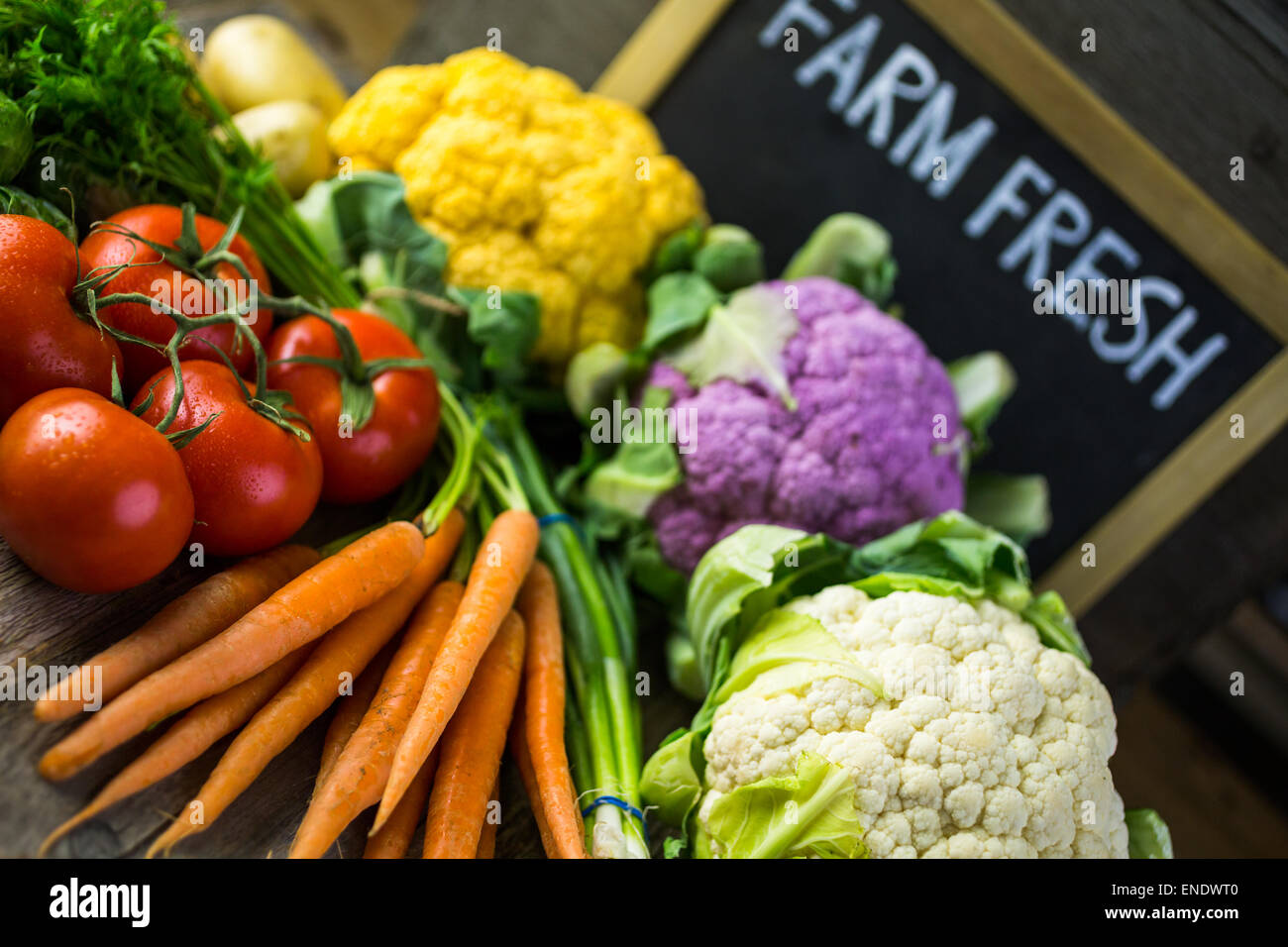 Fresh organic vegetable in season on old farm table Stock Photo - Alamy