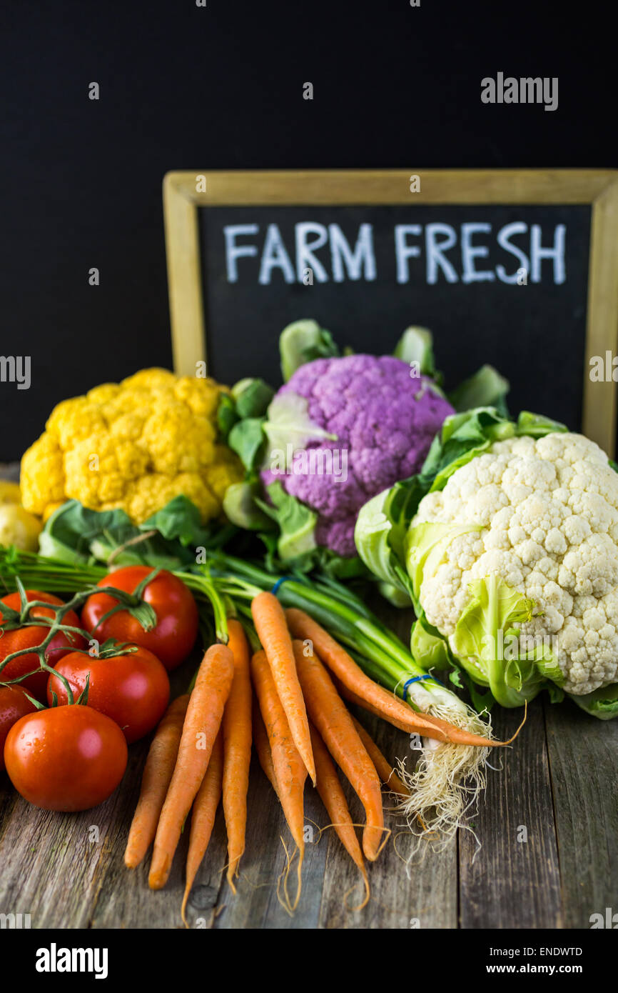 Fresh organic vegetable in season on old farm table Stock Photo - Alamy