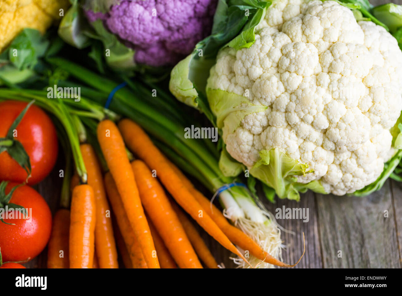 Fresh organic vegetable in season on old farm table Stock Photo - Alamy