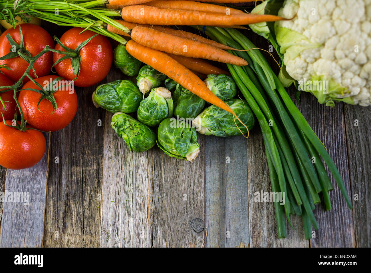 Fresh organic vegetable in season on old farm table Stock Photo - Alamy