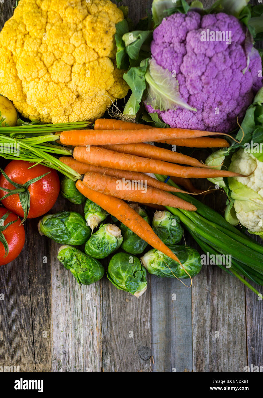 Fresh organic vegetable in season on old farm table Stock Photo - Alamy