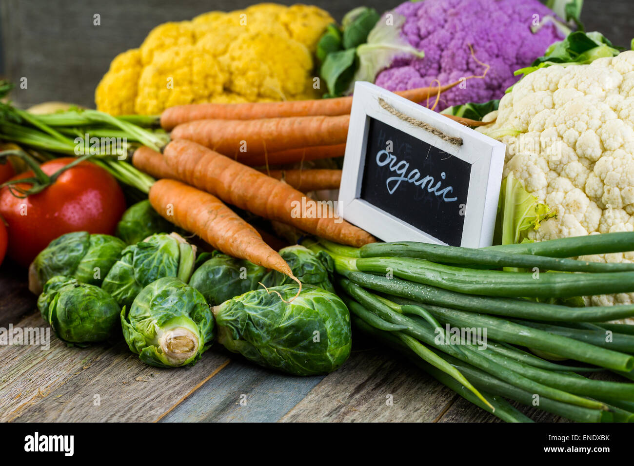 Fresh organic vegetable in season on old farm table Stock Photo - Alamy