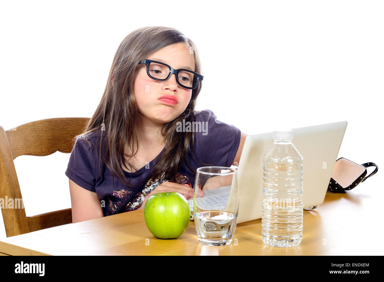 a little girl doing her homework on her computer on white Stock Photo ...