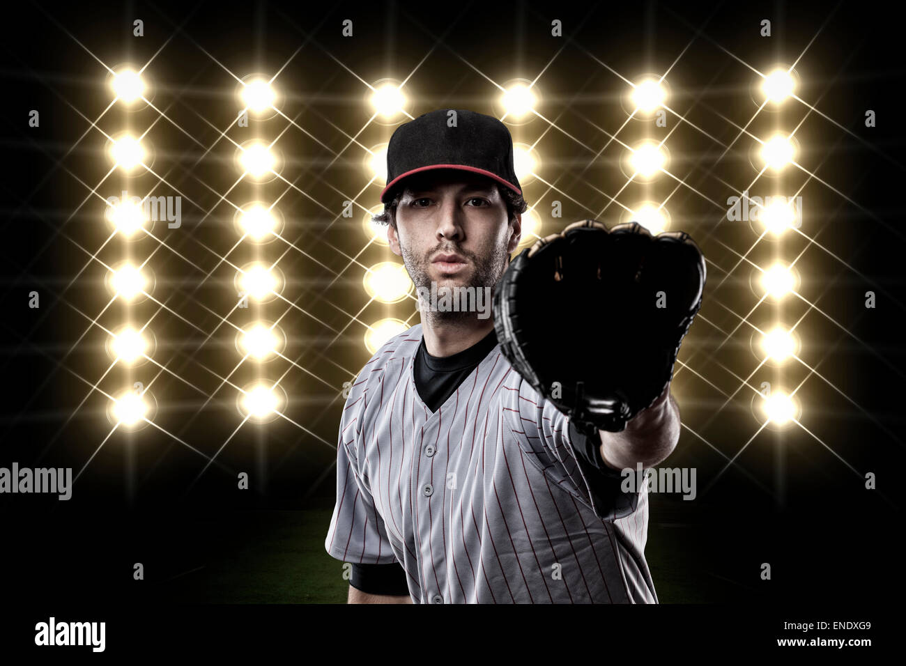 Baseball Player in front of lights Stock Photo - Alamy
