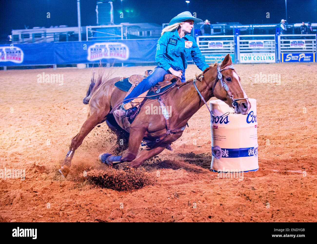 Cowgirl Participating in a Barrel racing competition in the Clark ...