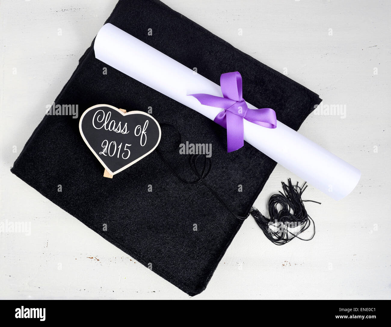 Graduation Day cap and diploma with Class of 2015 sample text on white ...