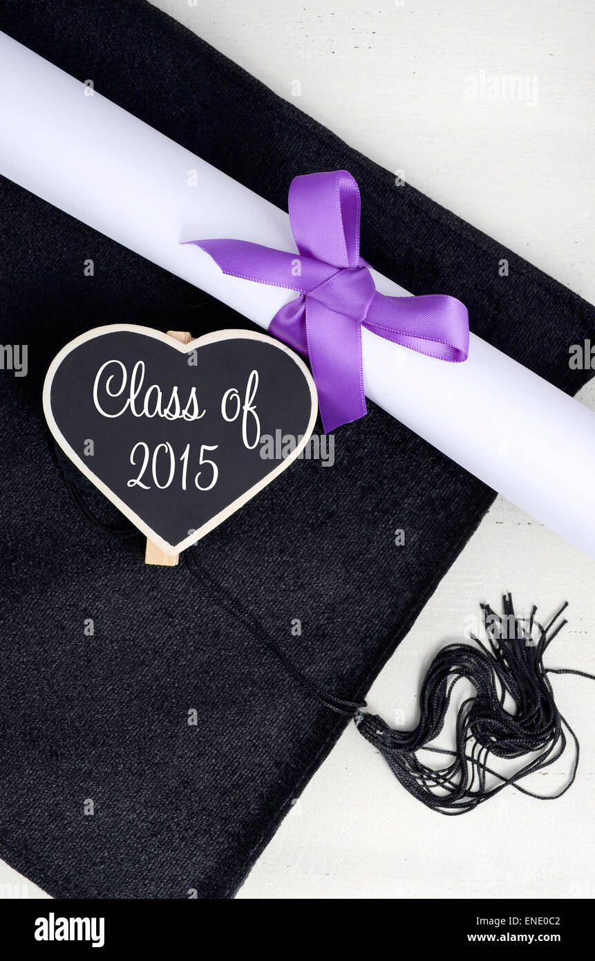 Graduation Day cap and diploma with Class of 2015 sample text on white ...