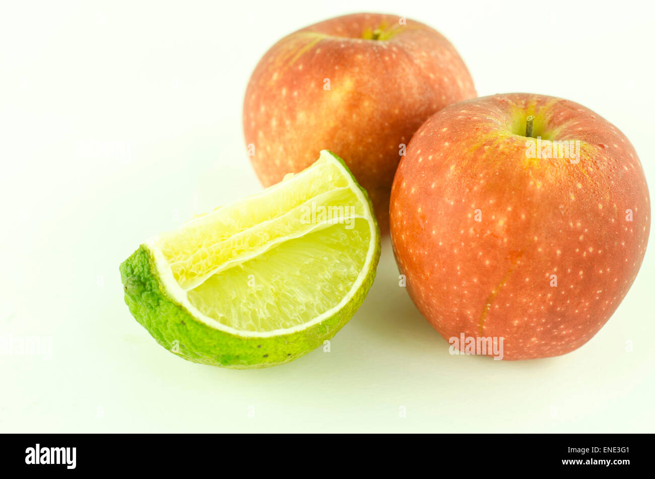 two apple and lime isolated on white background Stock Photo - Alamy