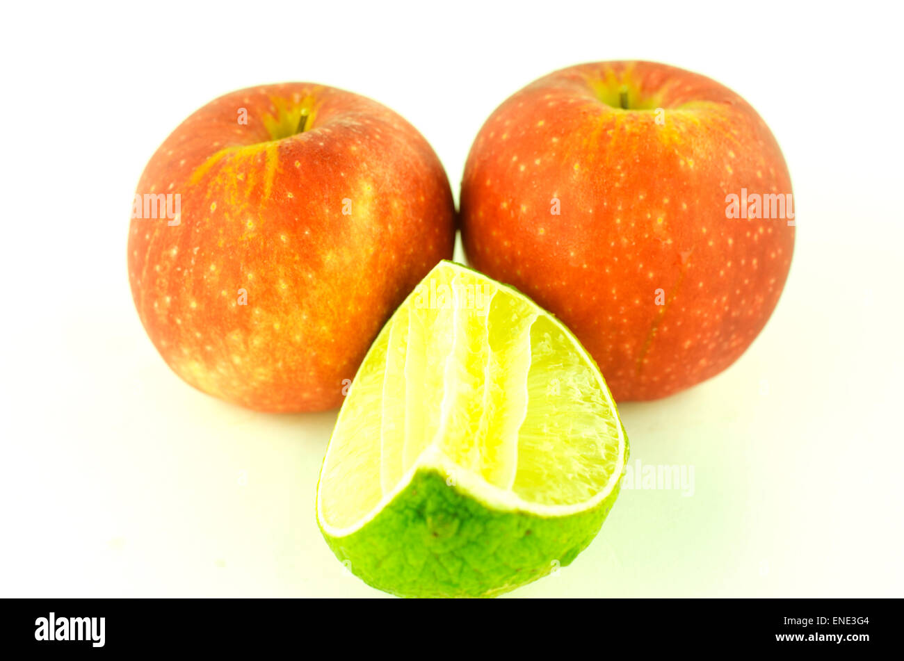 two apple and lime isolated on white background Stock Photo - Alamy