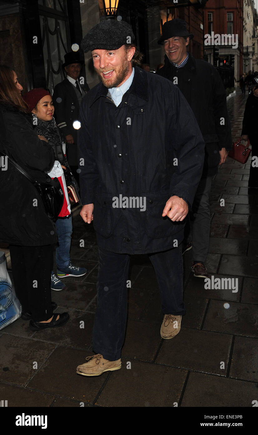 An unshaven Guy Ritchie leaves Claridge's wearing a wax jacket and flat ...