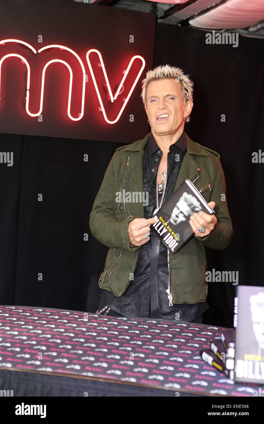 Punk rock star Billy Idol signs copies of his autobiography 'Dancing ...
