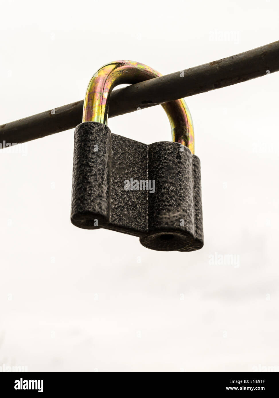 Strong tempered steel padlock locked onto a secure iron rod Stock Photo ...