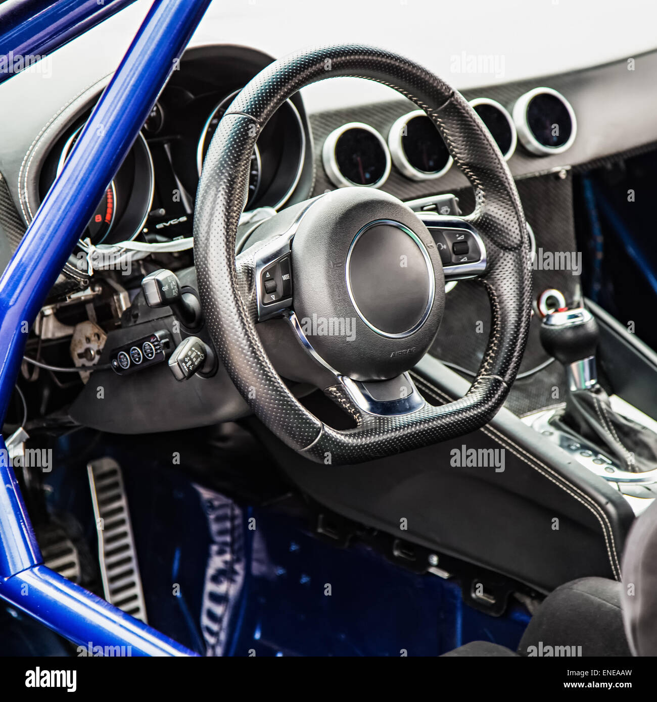 Steering wheel in interior of the sports car Stock Photo - Alamy