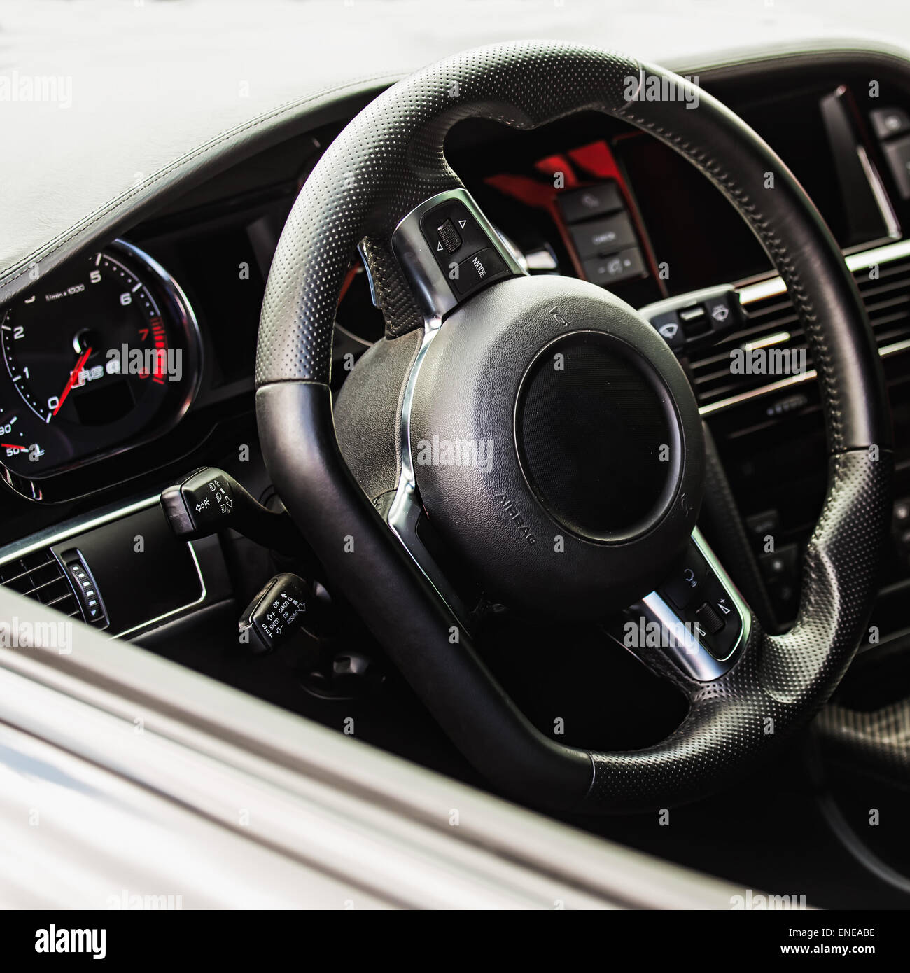 Steering wheel in interior of the sports car Stock Photo - Alamy