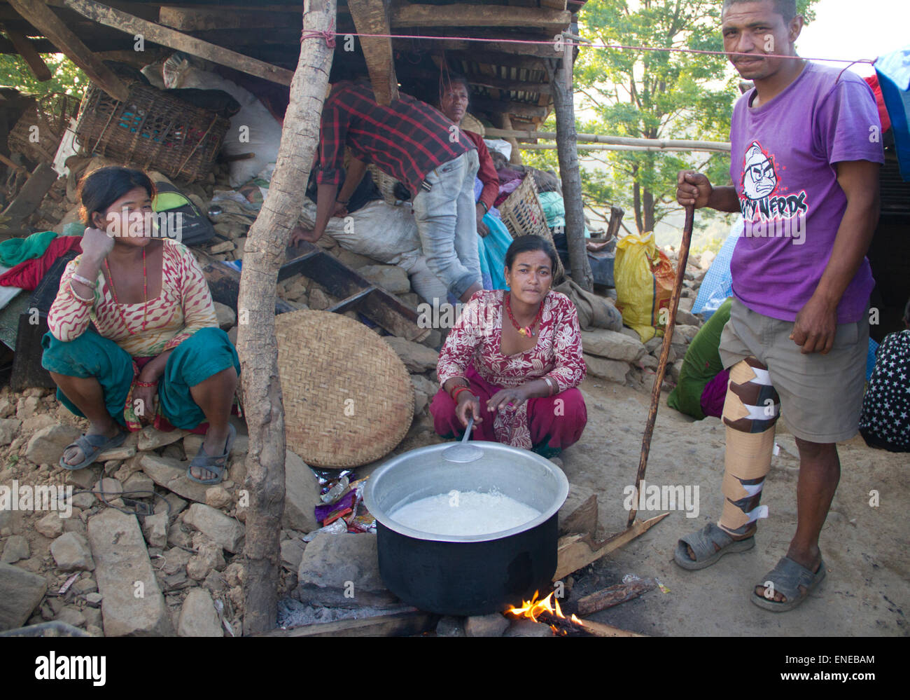Nepal. 3rd May, 2015. Women cook under a make shift shelter outside ...