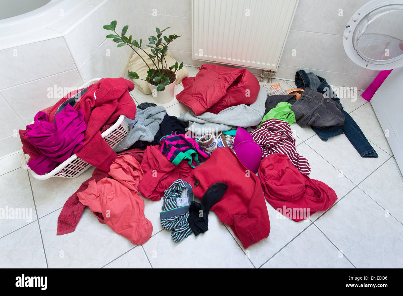 pile of dirty clothes ready for the wash in home bathroom Stock Photo ...