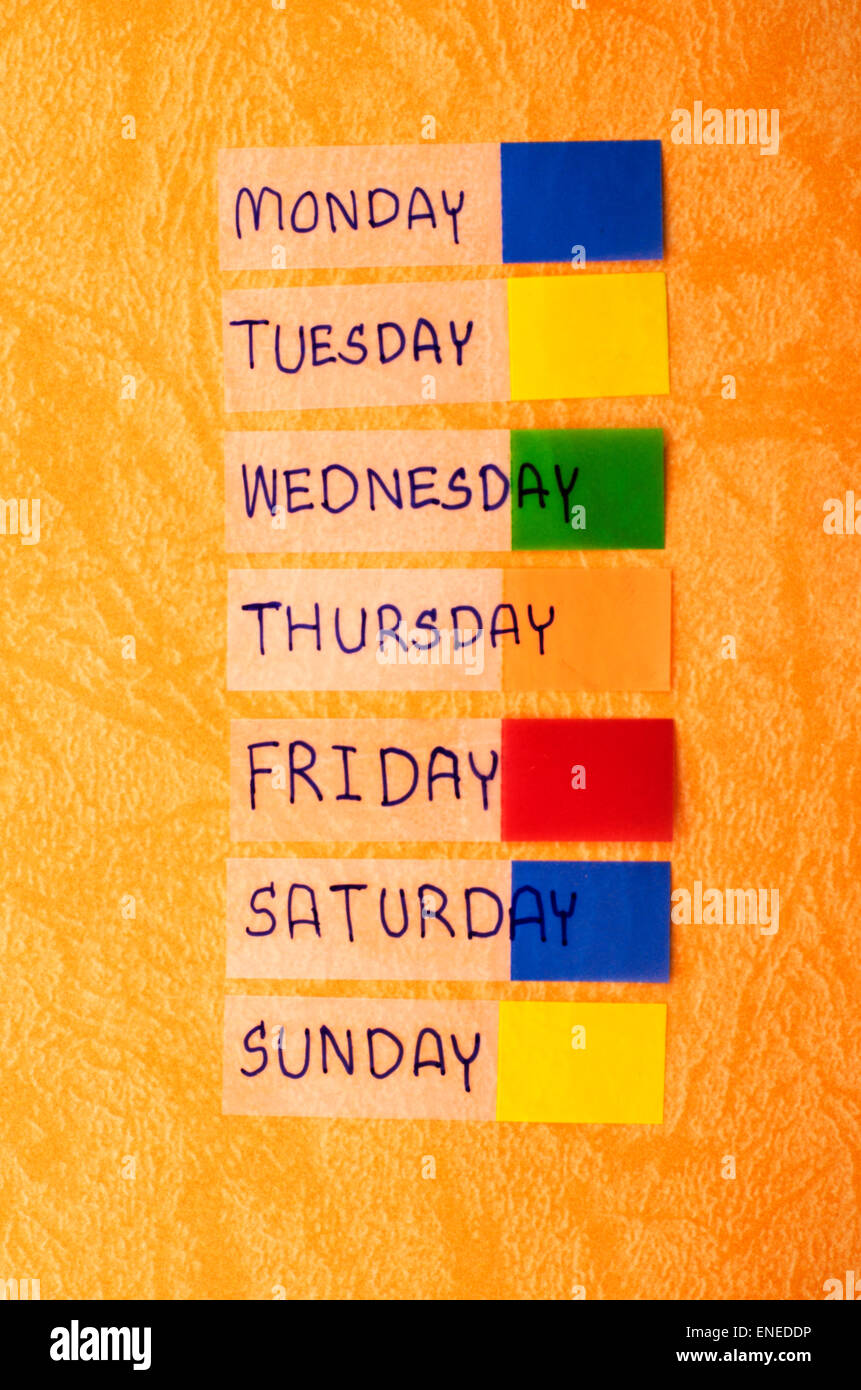 post it monday to sunday on orange background Stock Photo - Alamy