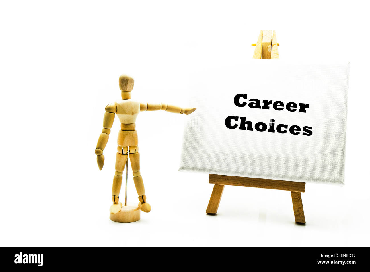 Wooden man with white board pointing at words "career choices" future ...