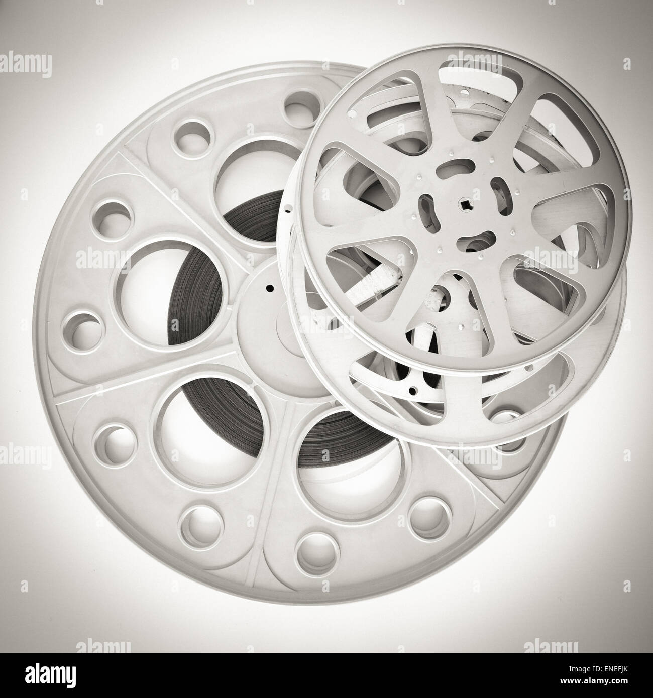 Pile of three different movie reels with 35mm film in black and white ...