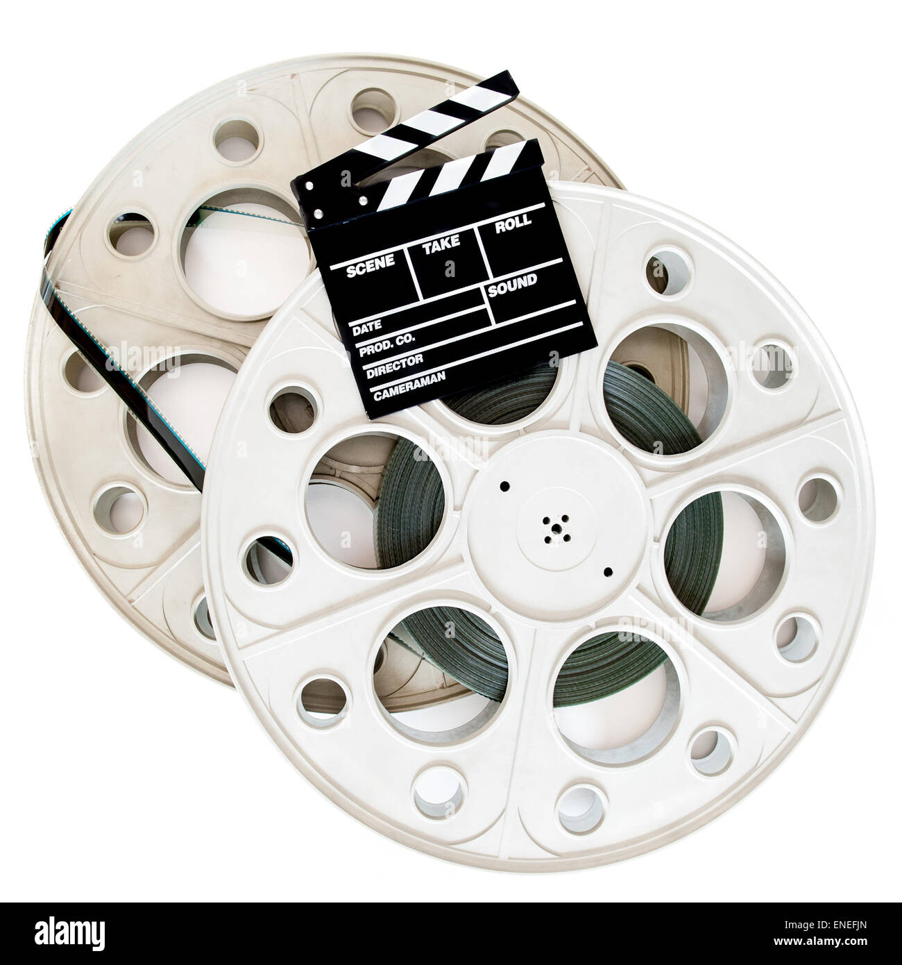 Movie clapper on two 35 mm cinema reels with film isolated on white ...