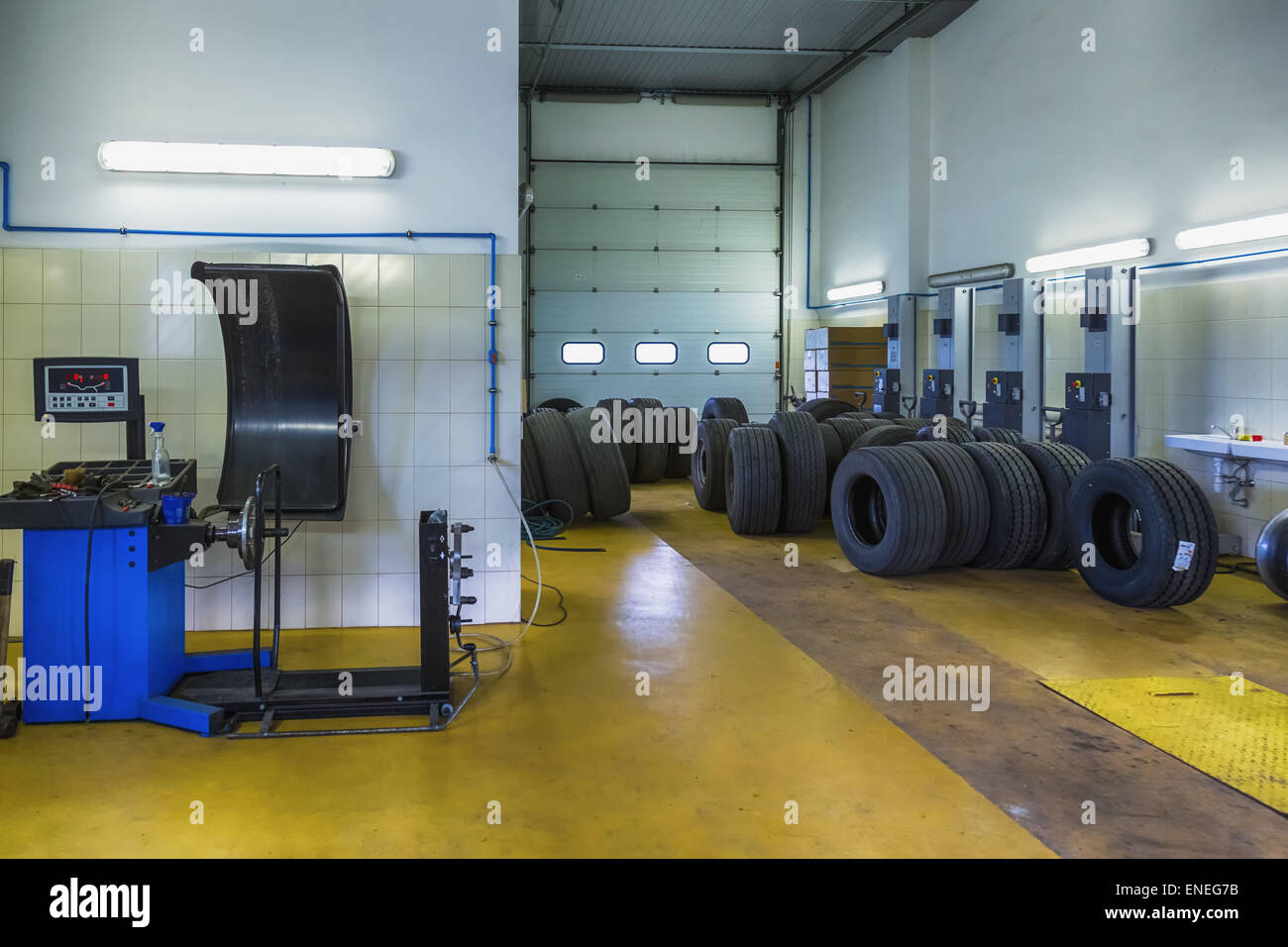 Truck tires or tires repair shop service interior with wheel balancer ...