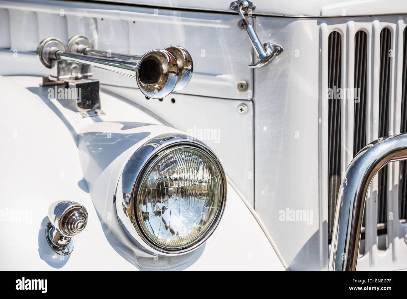 Old retro or vintage car or automobile front side with front lights or ...