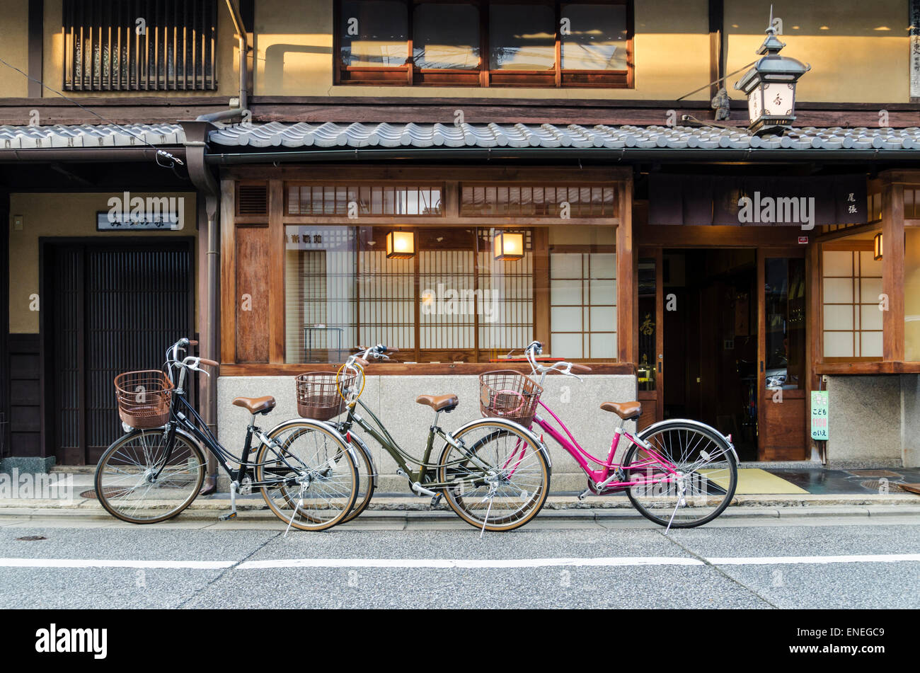 Bicycles outside a traditional wooden shop in Kyoto, Japan Stock Photo ...