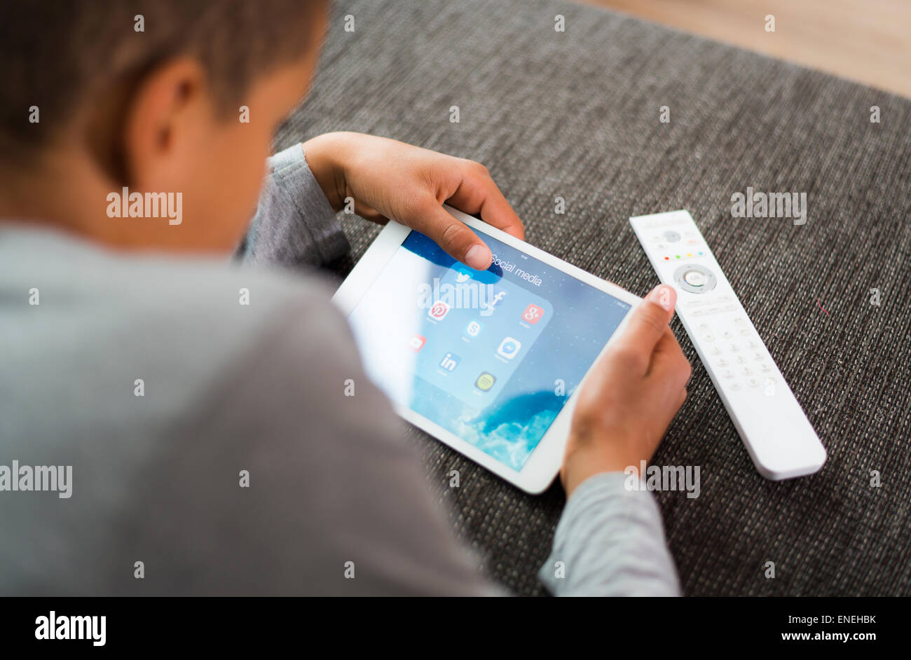 boy using ipad for online social media Stock Photo - Alamy