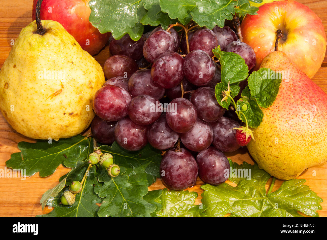 Assorted fruit on the old wooden table top Stock Photo - Alamy